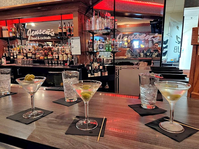 Jensen's bar gleams with potential and polished glassware, ready for your evening's libations. Those martinis aren't just sitting there&mdash;they're practically winking at you.
