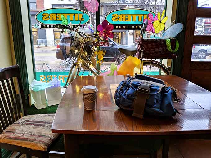 This window table with a bicycle decoration is prime real estate for watching the world go by, pastry in hand.