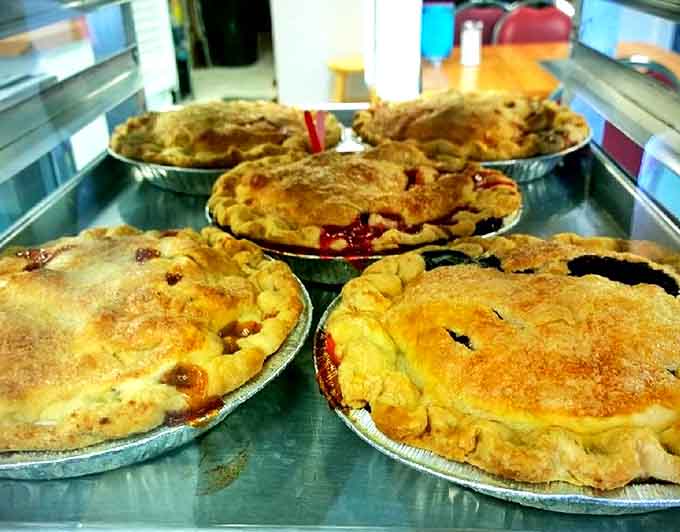 Those golden-crusted pies cooling on the counter represent everything wonderful about homemade desserts done properly.