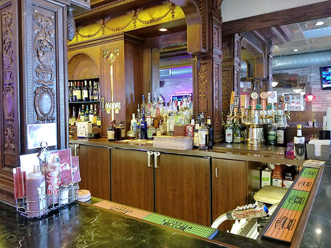 The ornate bar area gleams with polished wood and brass, offering a sophisticated spot to enjoy your pre-dinner drinks.