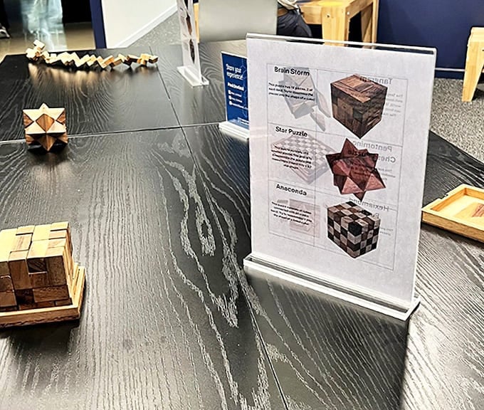 Wooden puzzles challenge visitors to test their spatial reasoning skills. Easier said than done when nothing is as it appears!