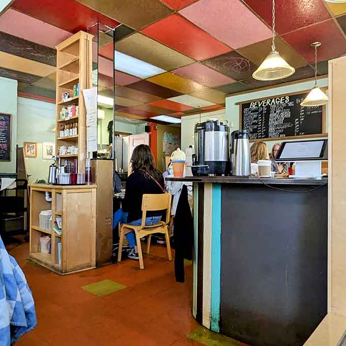 The counter area lets solo diners watch the kitchen action while enjoying their meal in comfortable solitude.