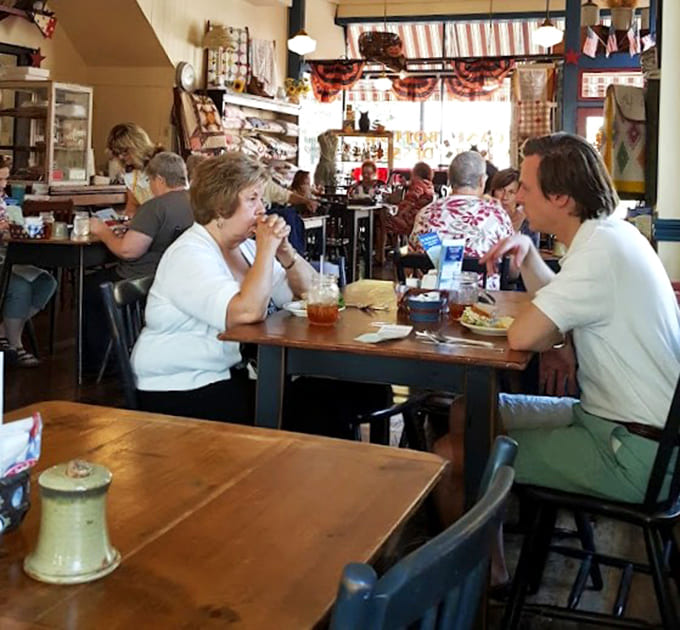 Real people enjoying real food in real conversation, a refreshing sight in our age of everyone staring at their phones.
