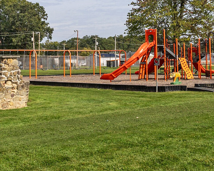The local playground stands ready for the kind of carefree afternoon play that both kids and adults secretly miss.