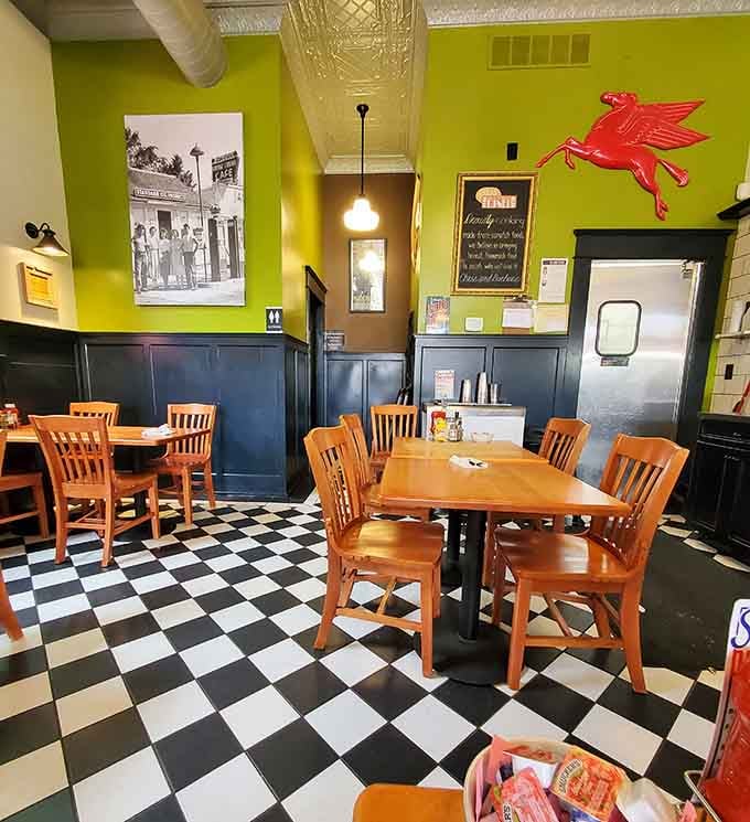 Bright walls and comfortable seating create a space where lingering over coffee feels not just acceptable but encouraged.