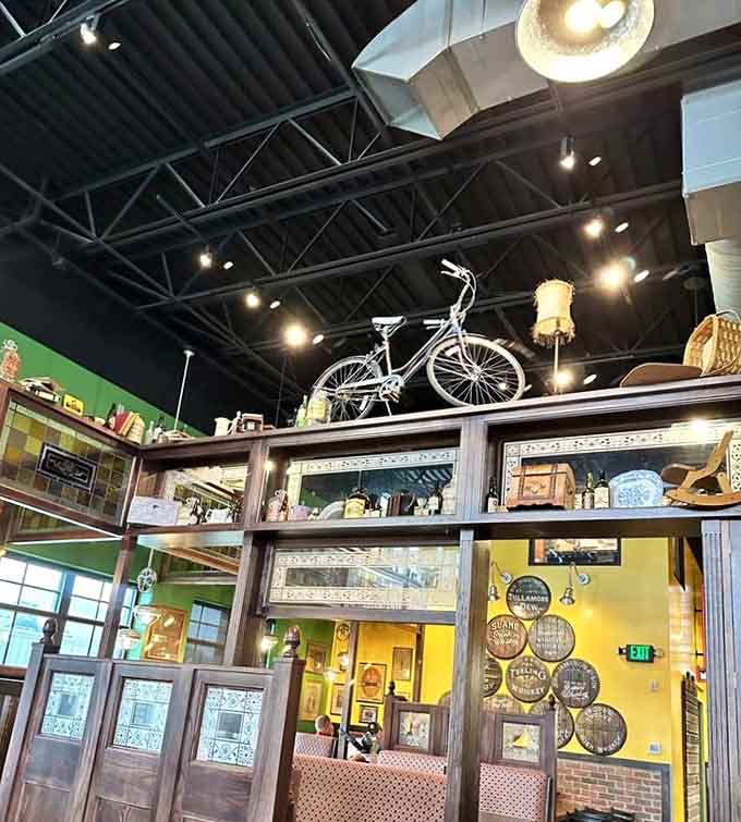 A bicycle hangs overhead among vintage treasures, because why not add whimsy to your authentic Irish pub experience in Minnesota.