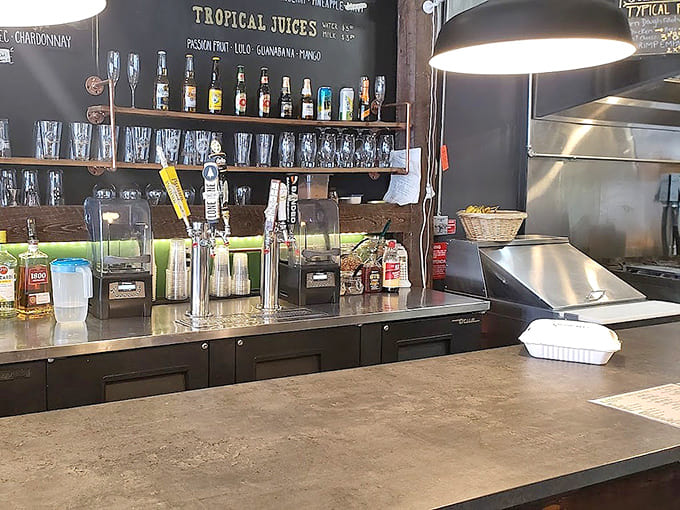 The bar area displays tropical juices and spirits, ready to transform into refreshing beverages that transport you somewhere much warmer.