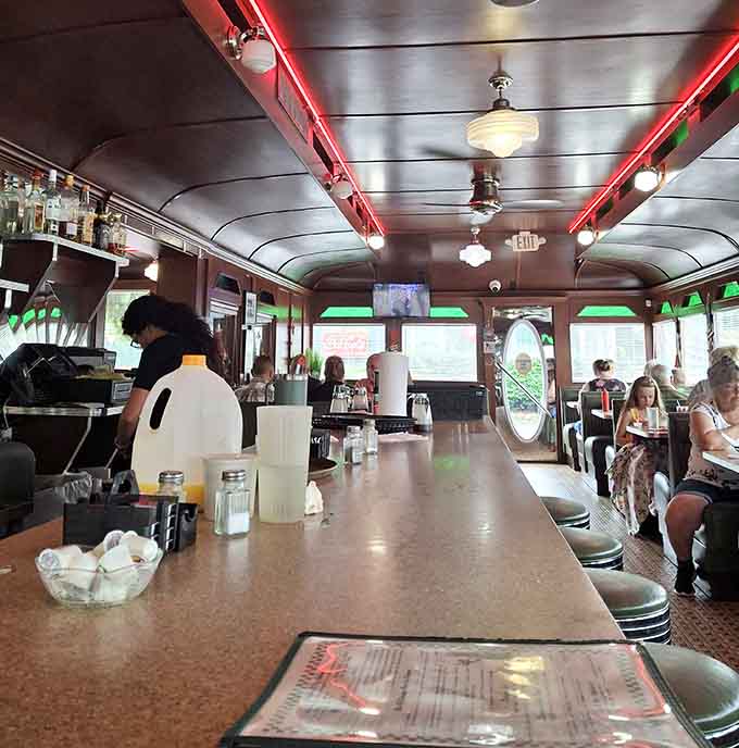 The long counter stretches invitingly, promising good conversation, better coffee, and the kind of meal that makes everything right.