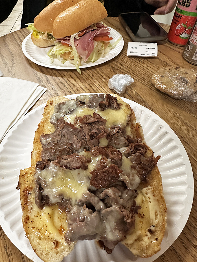 Behold the Steak Bomb: thinly sliced beef, melted cheese, and savory toppings creating an explosion of flavor in every bite.