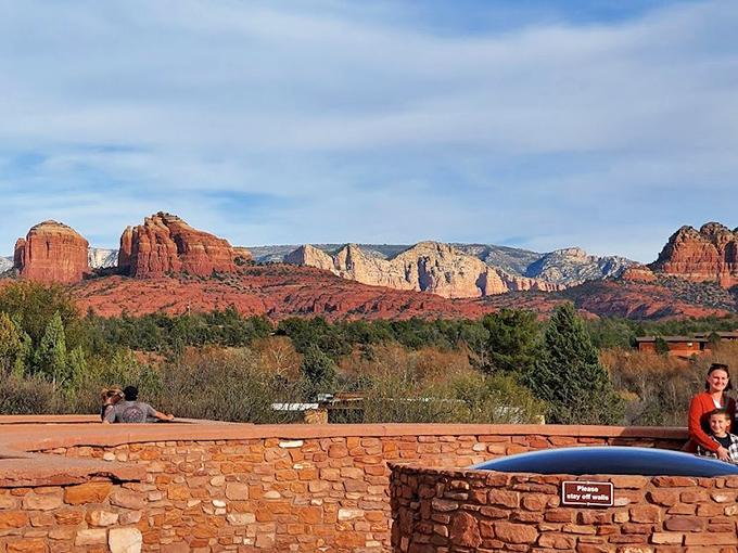 From this stone-walled overlook, visitors can drink in panoramic views that stretch for miles across Sedona's red rock country.