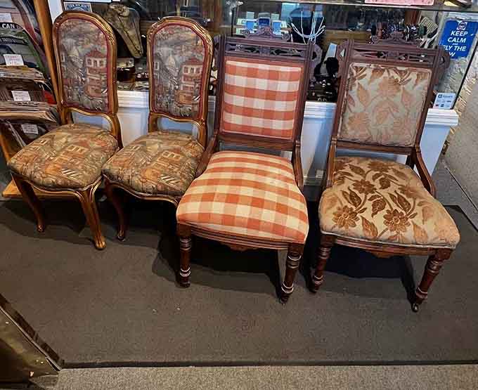 Vintage chairs show off their upholstered personalities, from cheerful gingham to elaborate floral tapestries that demand attention and admiration.