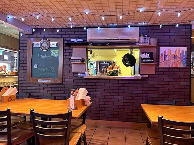 Wooden booths and tables create an inviting space where comfort food meets comfortable seating in perfect harmony.