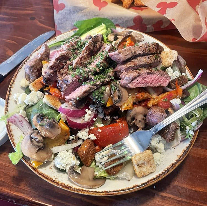 Sliced sirloin crowning a mountain of roasted vegetables and greens, for when you want to feel virtuous while indulging.