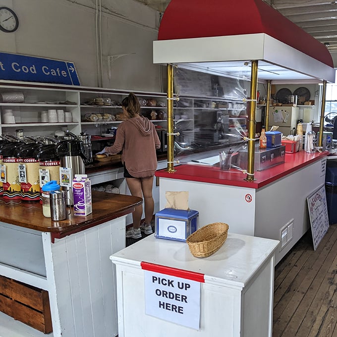 Behind the counter, culinary magic happens with focused efficiency &ndash; where simple ingredients become extraordinary in skilled hands.