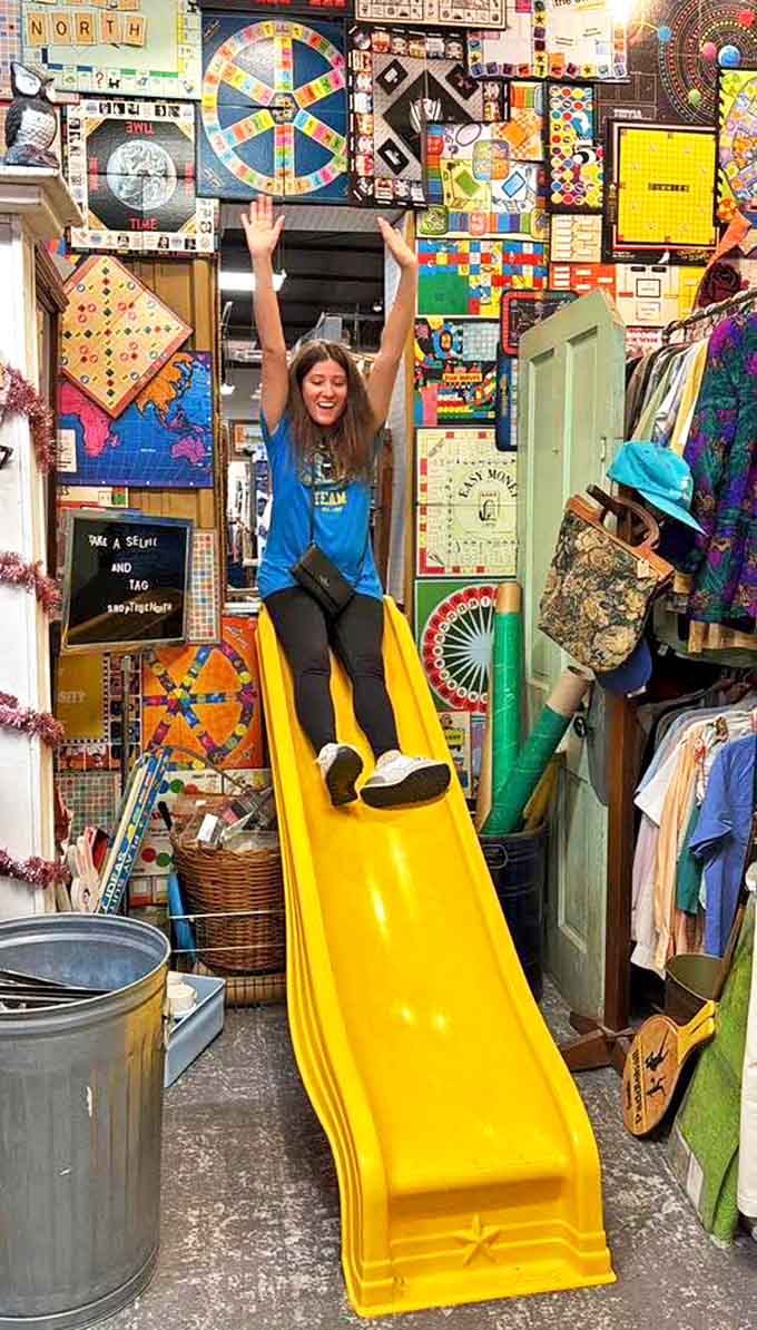 Joy captured mid-flight &ndash; this yellow slide nestled among vintage board games proves True North understands shopping should feel like play.