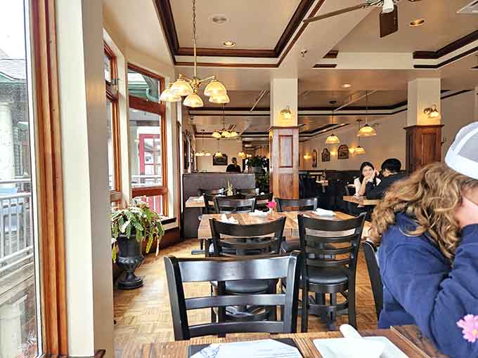 Cozy booth seating and warm lighting create the perfect setting for serious conversations about whether to order more tacos.