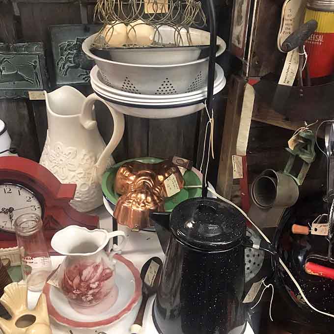 Vintage enamelware and collectibles create a colorful display that's equal parts nostalgia and "why don't they make things like this anymore?"