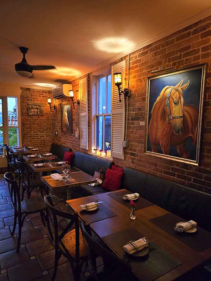 Exposed brick, equine art, and a name that promises a good time, this cozy spot knows that dinner should be an experience, not just a meal.