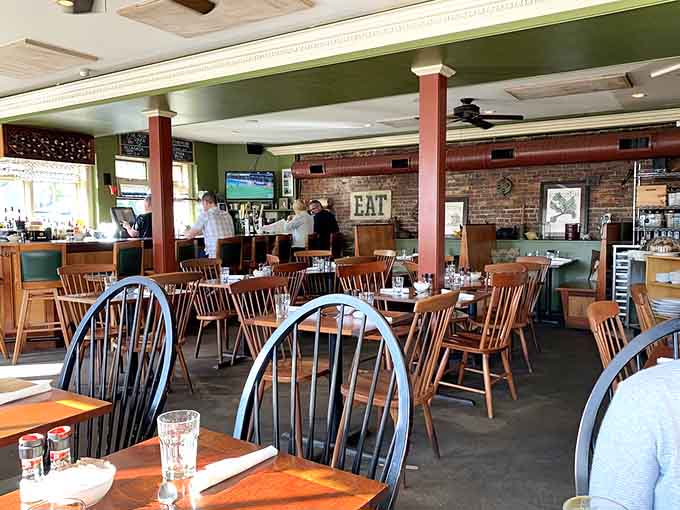 Wooden chairs and tables create a welcoming space that feels like your coolest friend's dining room.
