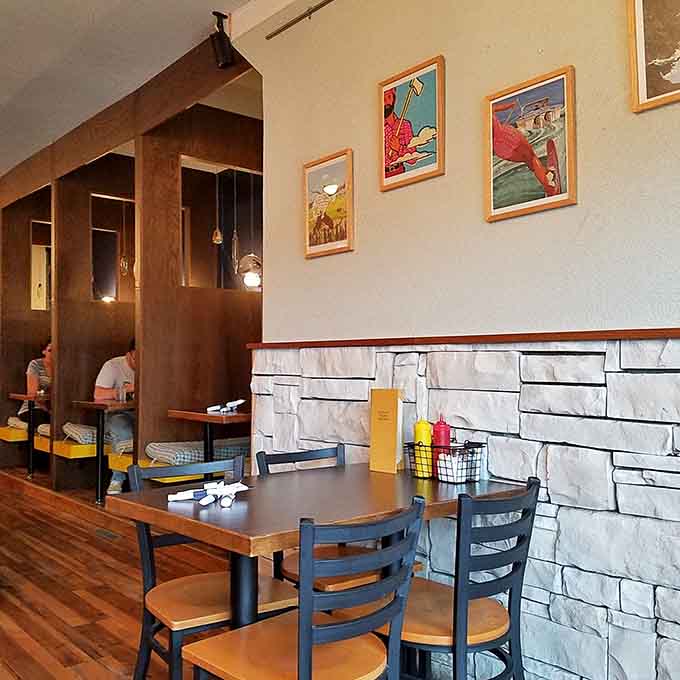 Vintage travel posters and thoughtful design details make every seat in the house feel like the right choice.