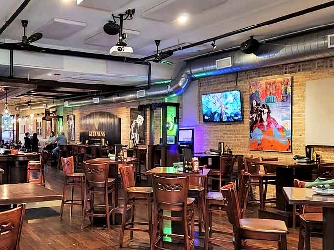 Modern meets traditional in this thoughtfully designed dining space where exposed brick, wooden tables, and strategic lighting create the perfect backdrop for memorable meals.