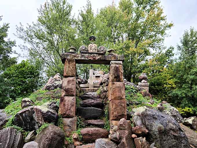 Stone pillars rise from the earth like ancient ruins, except these ruins were built yesterday and come with explanatory plaques for the historically curious.