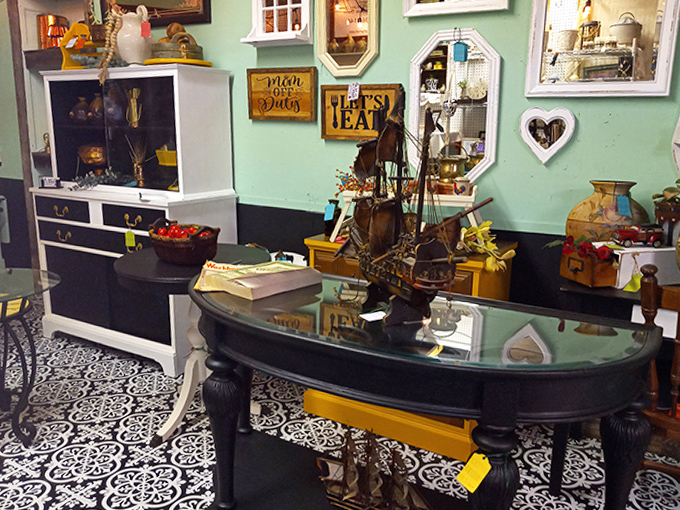 This nautical-themed display transforms an ordinary table into a maritime adventure, complete with model ship and seafaring accessories.