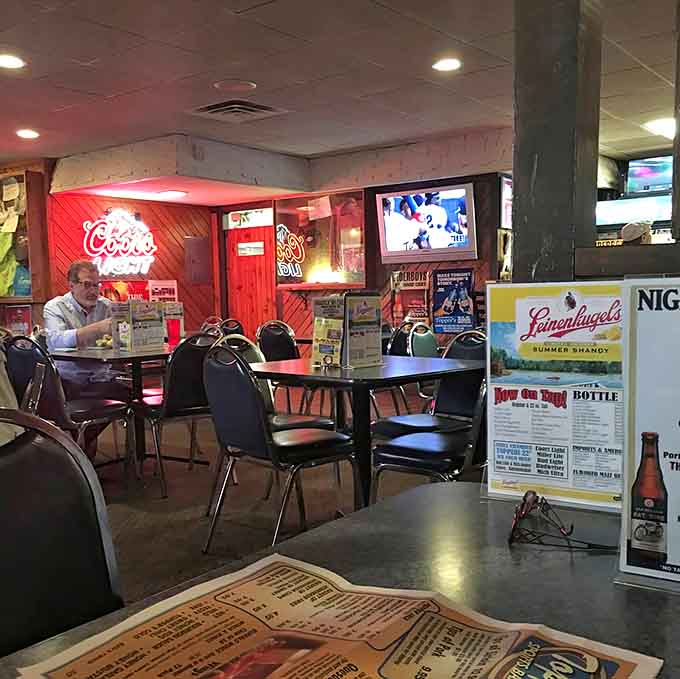 Comfortable booths and tables fill the dining space, offering plenty of room for families, friends, and solo diners alike.