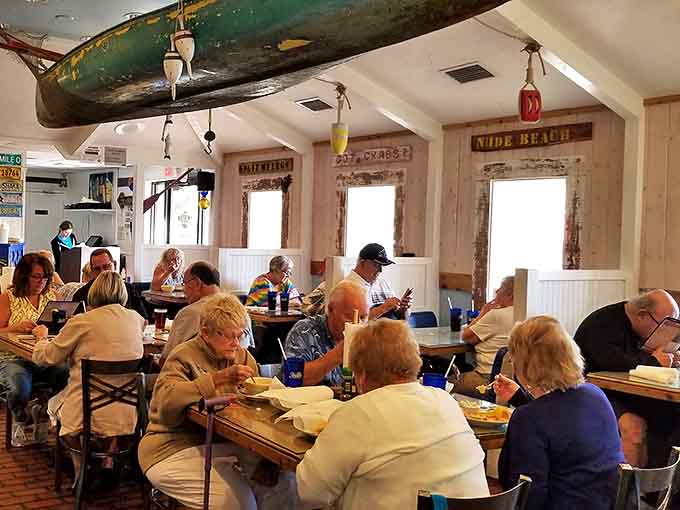 Happy diners fill the tables at lunchtime, proving that good food brings people together. The casual atmosphere encourages lingering conversations over exceptional meals.