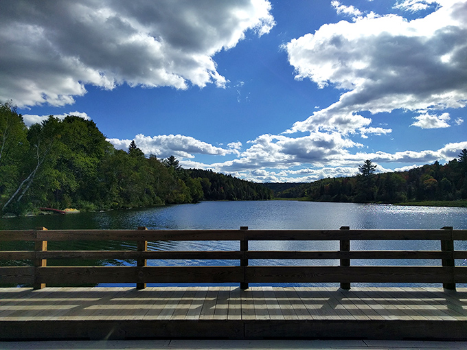 The view from the bridge captures Vermont's essence&mdash;tranquil waters, verdant shores, and skies that promise endless possibilities.