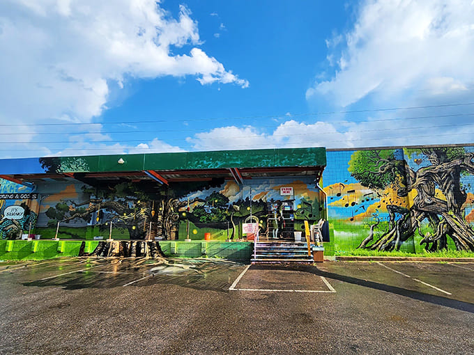 Nature-inspired murals wrap the building in a verdant embrace, creating an artistic oasis that stands out brilliantly against Tallahassee's urban landscape.
