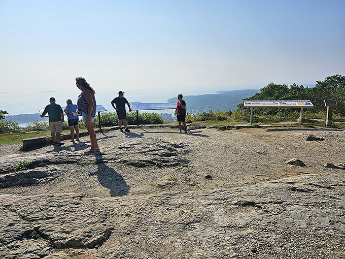 Visitors at the lookout experiencing that rare moment when reality exceeds expectations &ndash; no one's checking their phone here.