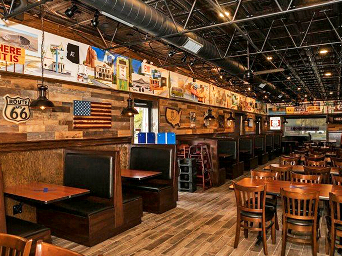 Wooden booths worn smooth by countless travelers tell stories of road trips past, while Route 66 artwork keeps the legends alive.