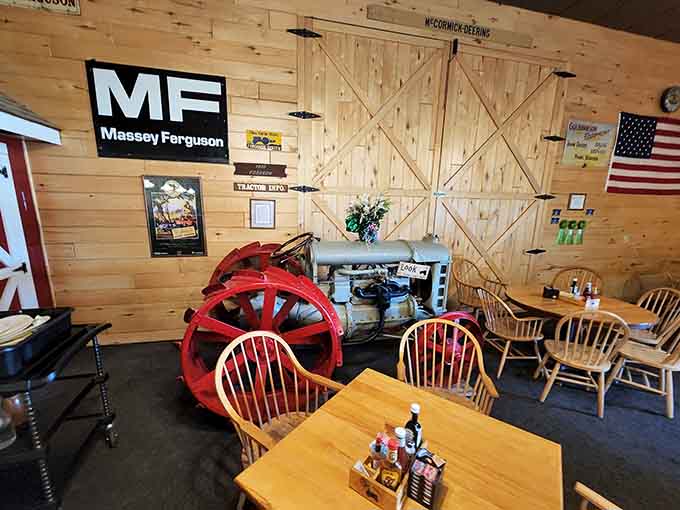 Vintage tractor displayed indoors because some folks really love their farm equipment, and honestly, who can blame them?