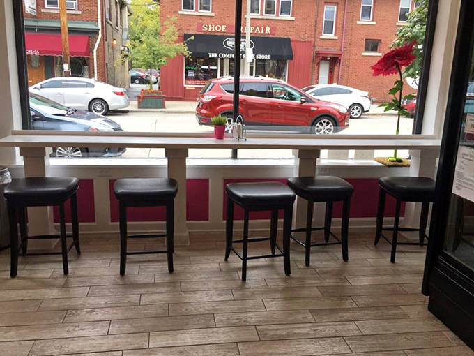 Window seating offers the perfect perch for people-watching while savoring something sweet from the legendary bakery.