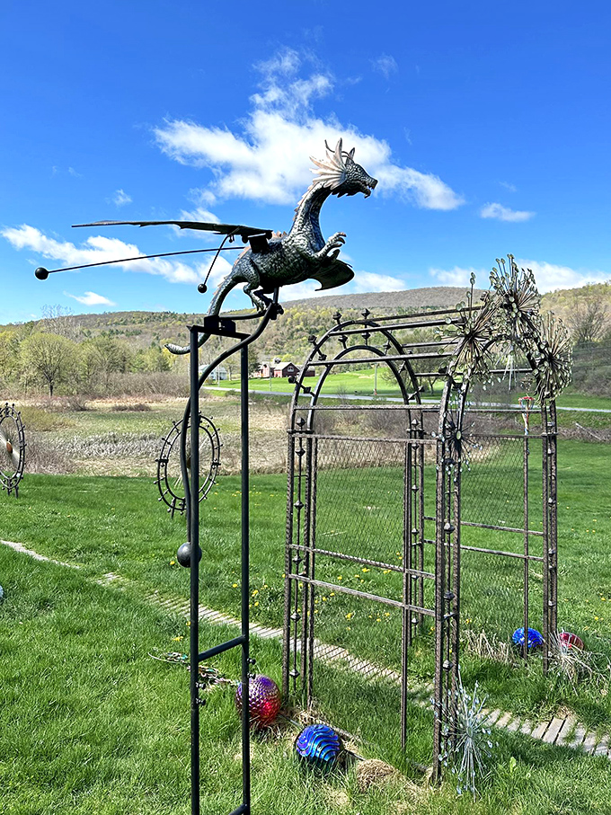 Where metal meets magic &ndash; this dragon-topped archway isn't just garden decor; it's a portal between the mundane world and a realm where imagination takes flight.