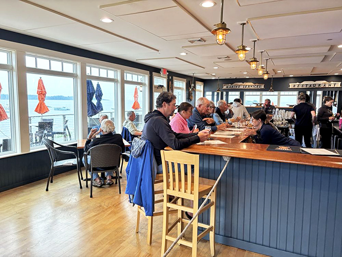 The bar area buzzes with a comfortable energy, where locals and visitors alike gather to share stories over drinks and fresh-caught seafood.