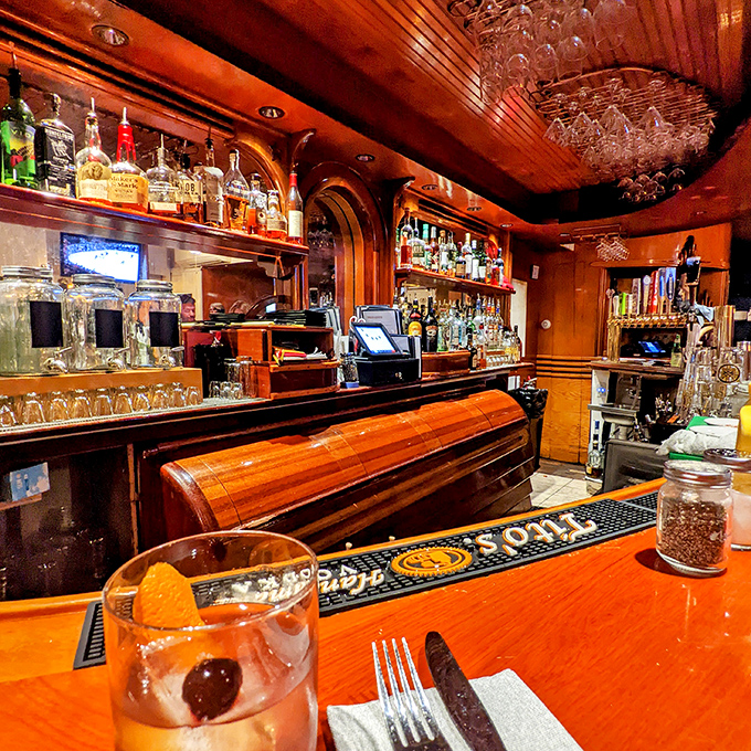 The gleaming wooden bar, polished by countless elbows and careful bartenders, showcases an impressive array of spirits and local craft beers on tap.