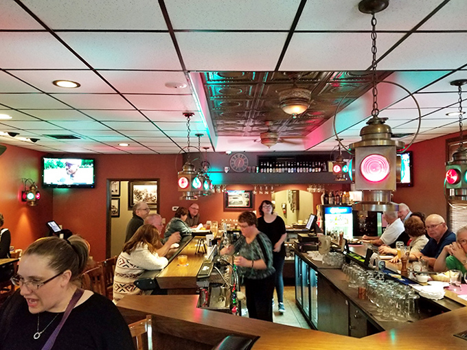 The bustling bar area serves as Plymouth's living room, where strangers become friends over local brews and shared stories.
