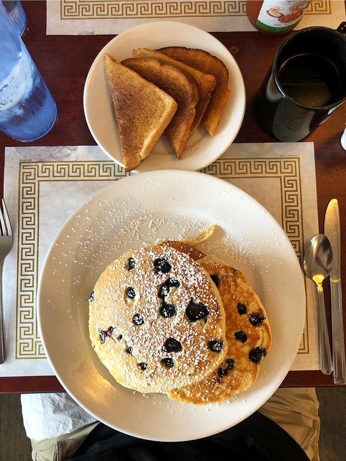 These blueberry hotcakes are so fluffy, they might float away if not anchored down by generous dollops of butter.
