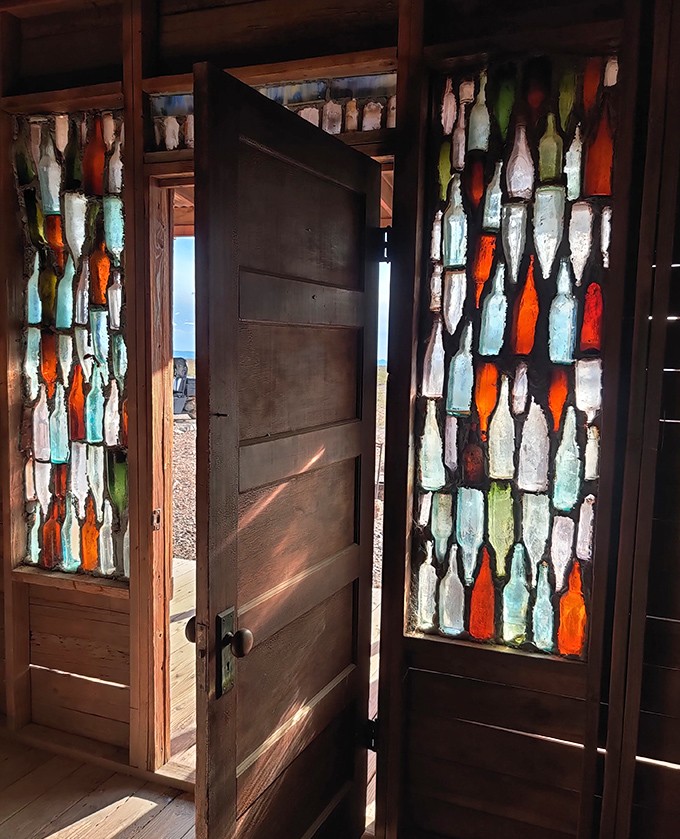 Sunlight transforms these colored bottles into a desert stained-glass masterpiece. Frontier ingenuity at its most unexpectedly beautiful.