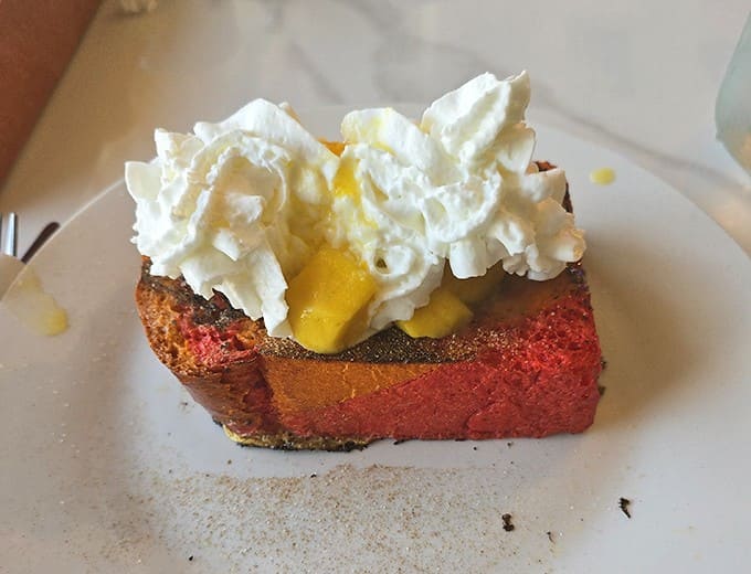 Cake: A technicolor slice of sweetness topped with whipped cream &ndash; proof that breakfast and dessert are really just distant cousins.