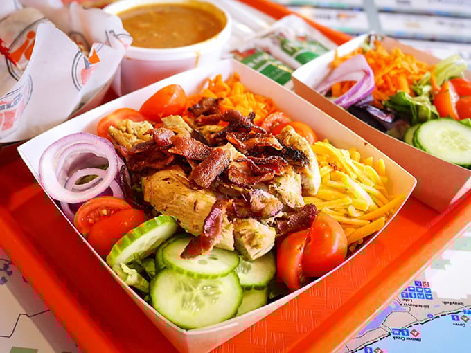 A fresh chicken salad that doesn't feel like punishment for skipping the burger &ndash; colorful, crunchy, and topped with savory bacon.