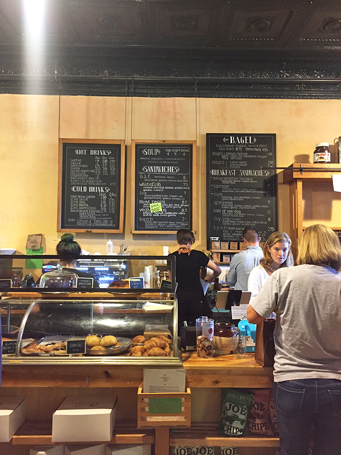 The bustling counter showcases both the day's fresh offerings and the friendly staff who make Forage feel like home.