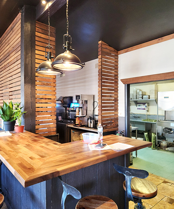 The wooden bar area showcases the cafe's rustic charm &ndash; where locals and travelers alike find common ground over good food.