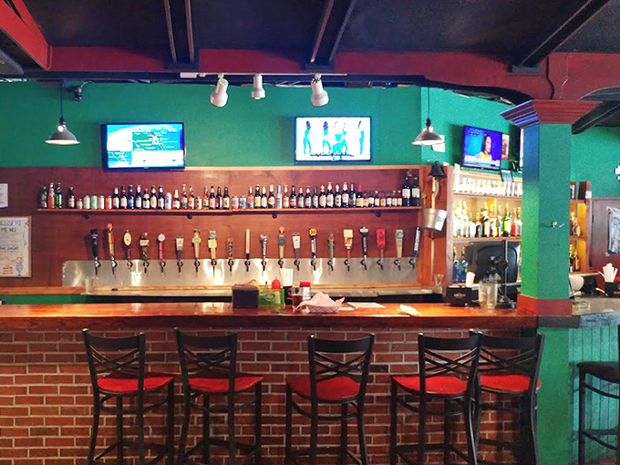 Red-cushioned barstools invite you to belly up where the magic happens &ndash; a front-row seat to cocktail craftsmanship and sports action.