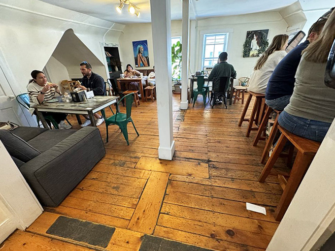 Community in action: The caf&eacute;'s warm wooden interior creates the perfect backdrop for both intimate conversations and people-watching.