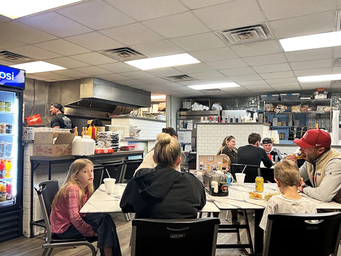 Families gather around simple tables, creating memories that will last longer than their vacation tans.