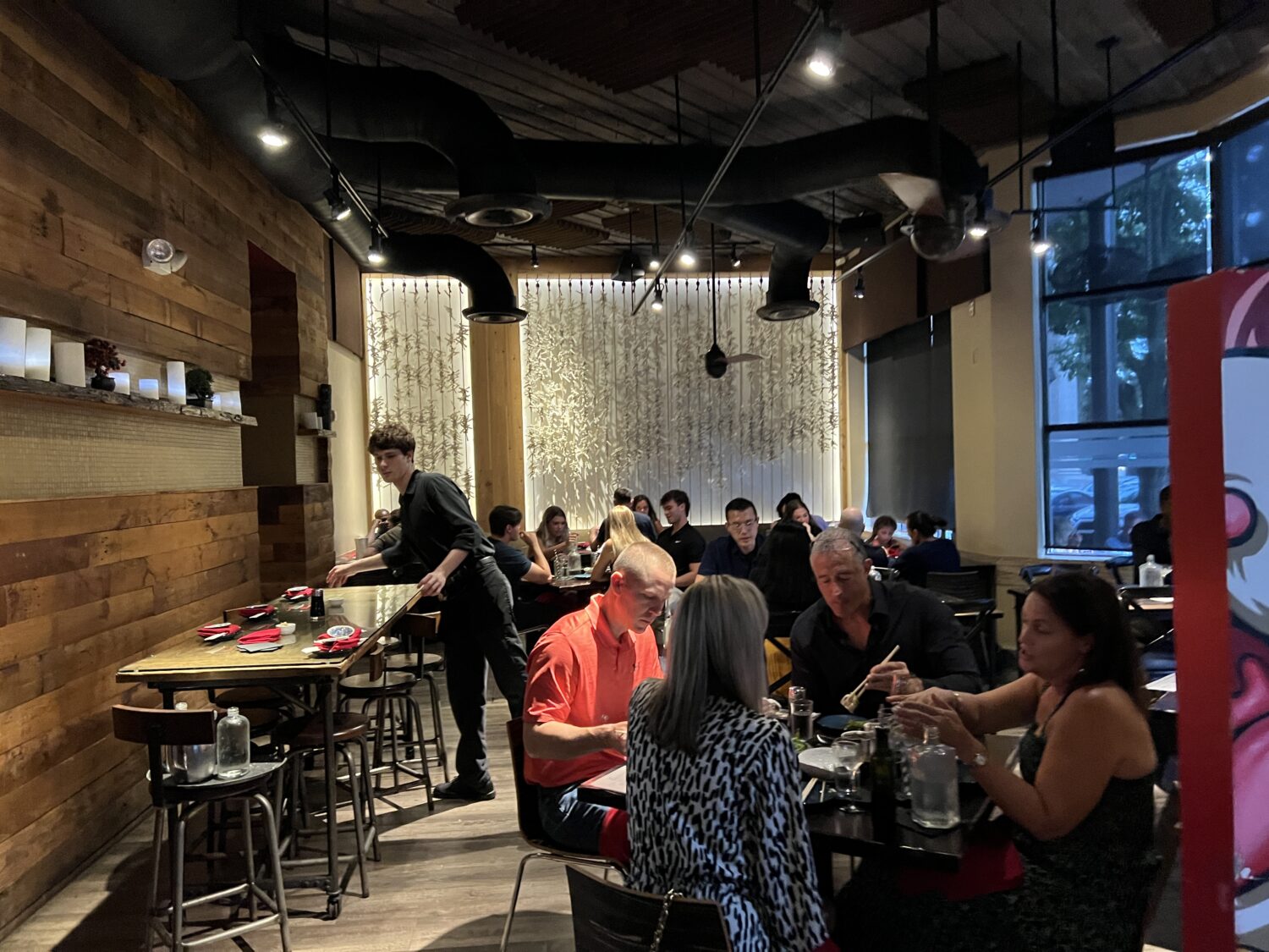 The bustling dining room hums with conversation and clinking glasses – proof that great food brings people together across any cultural divide.