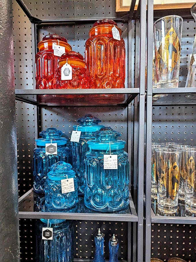 Vintage glass canisters in amber and azure create an organized rainbow of possibilities. Perfect for storing everything from pasta to potpourri with retro flair.